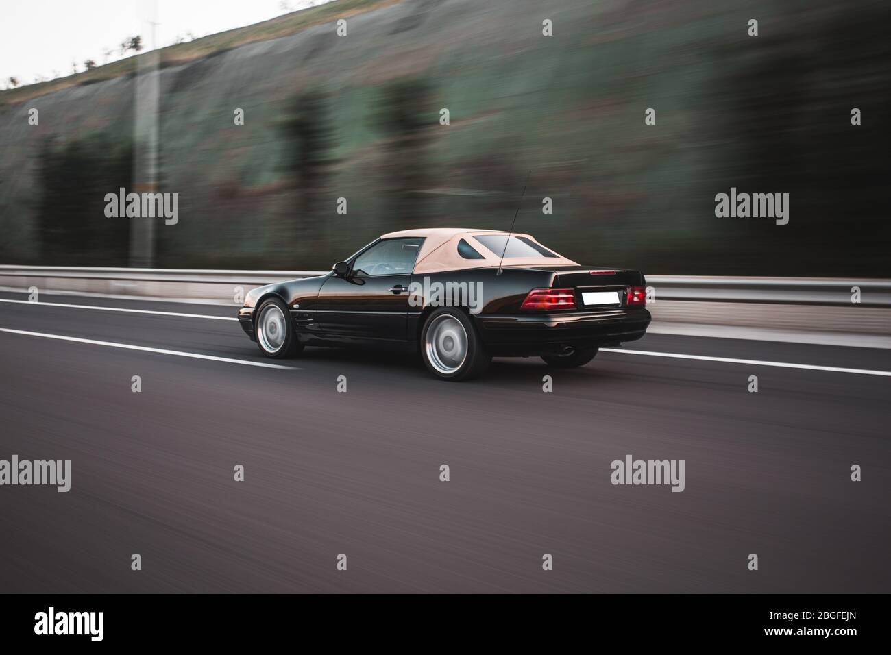 Old model sedan car in the downtown road Stock Photo - Alamy