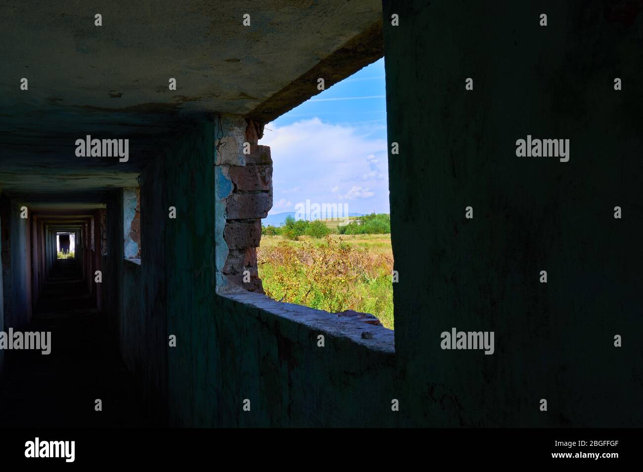 the view through a window from the Interior of an abandoned building in ...