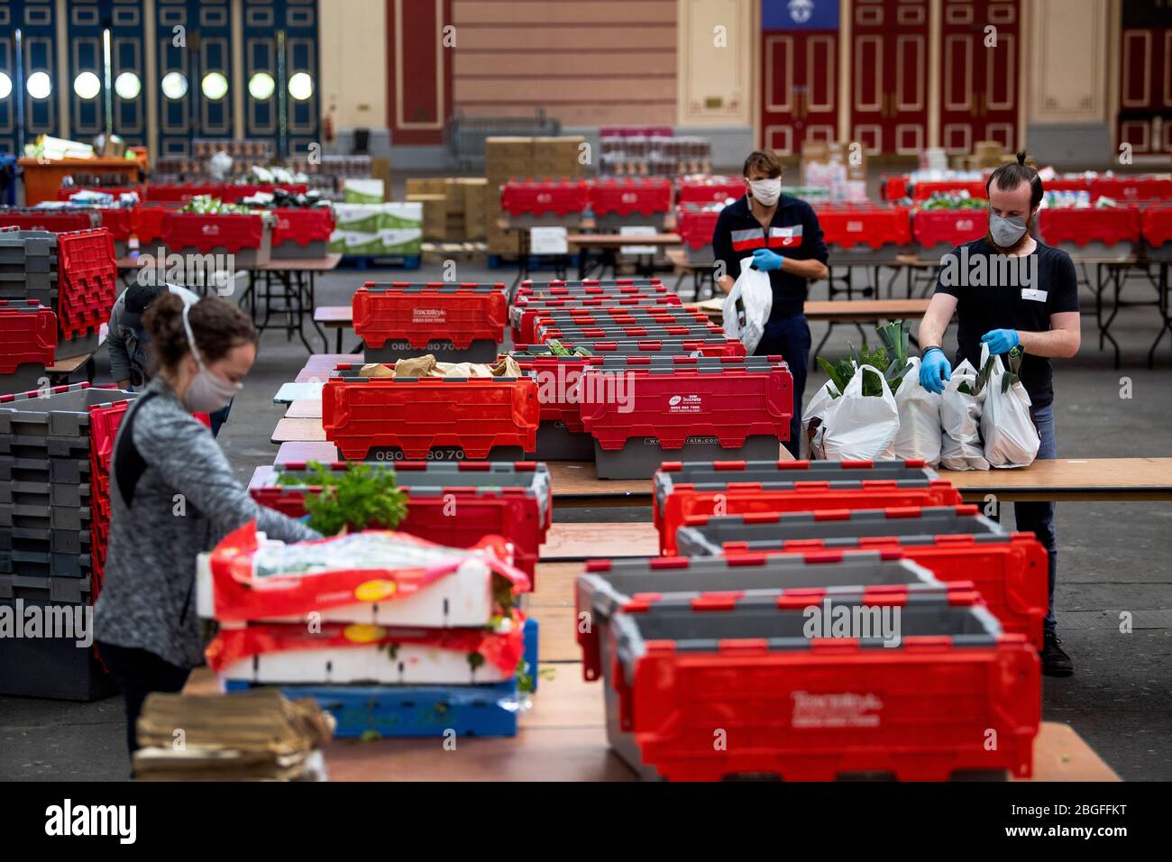 Volunteers from the Edible London food project help to prepare food ...