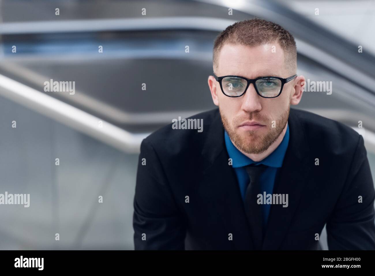 Man standing on stairs hi-res stock photography and images - Alamy