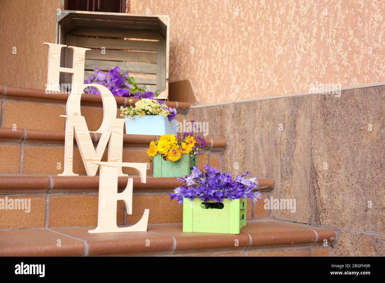 Stair steps decoration with wildflowers and decorative letters Stock ...