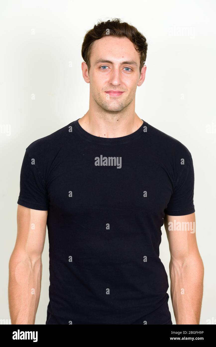 Portrait of young handsome man looking at camera Stock Photo - Alamy