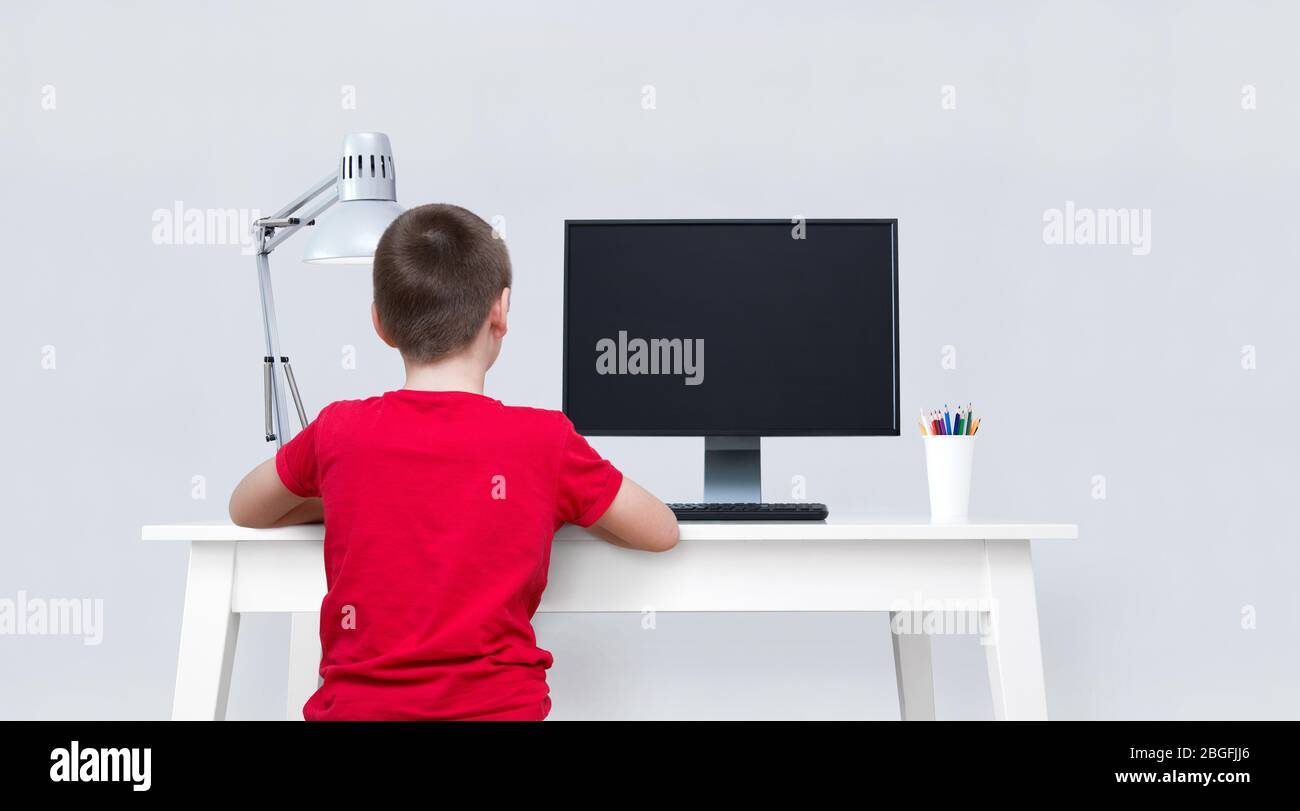 Boy working on the computer mockup Stock Photo - Alamy