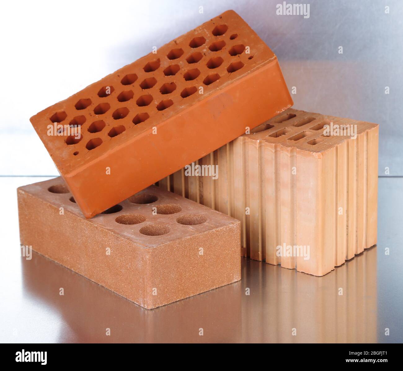 Bricks on metallic background Stock Photo - Alamy