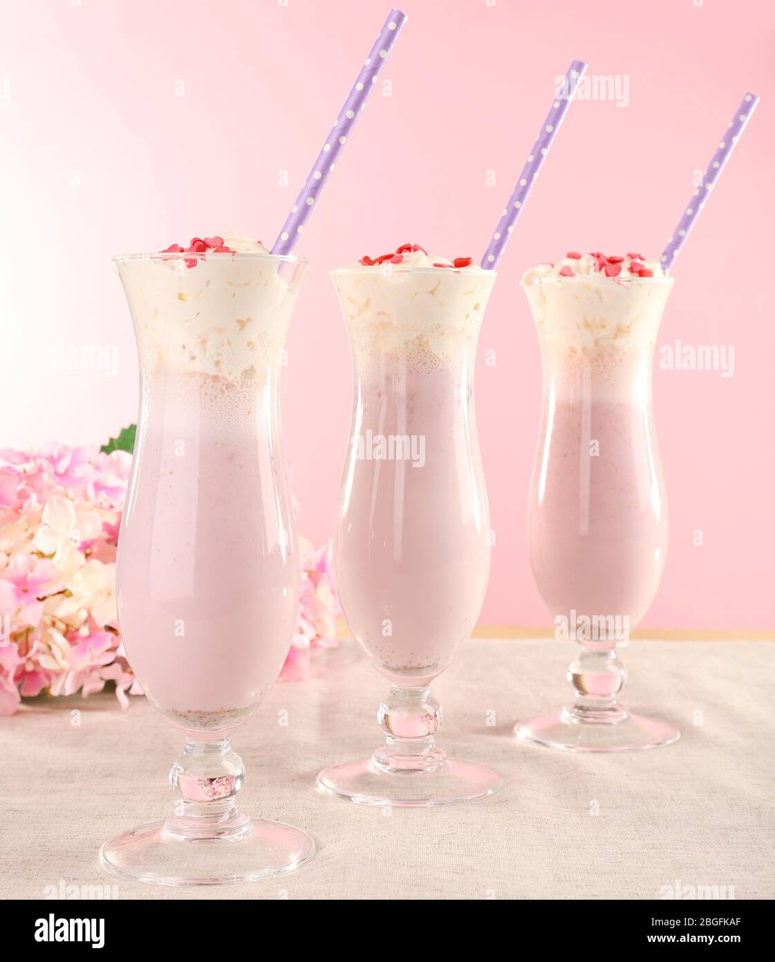 Delicious milkshake on table Stock Photo - Alamy