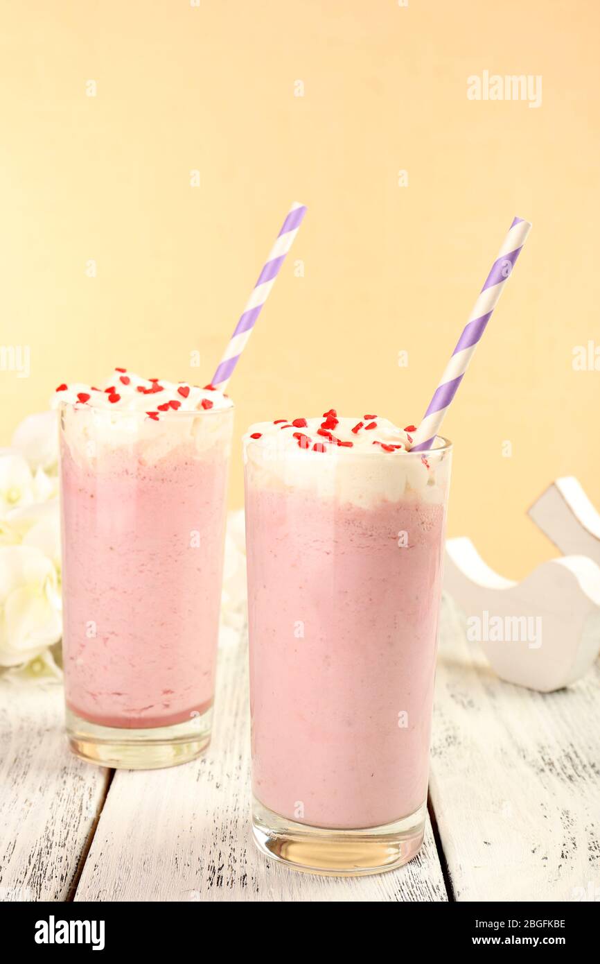 Delicious milkshake on table Stock Photo - Alamy
