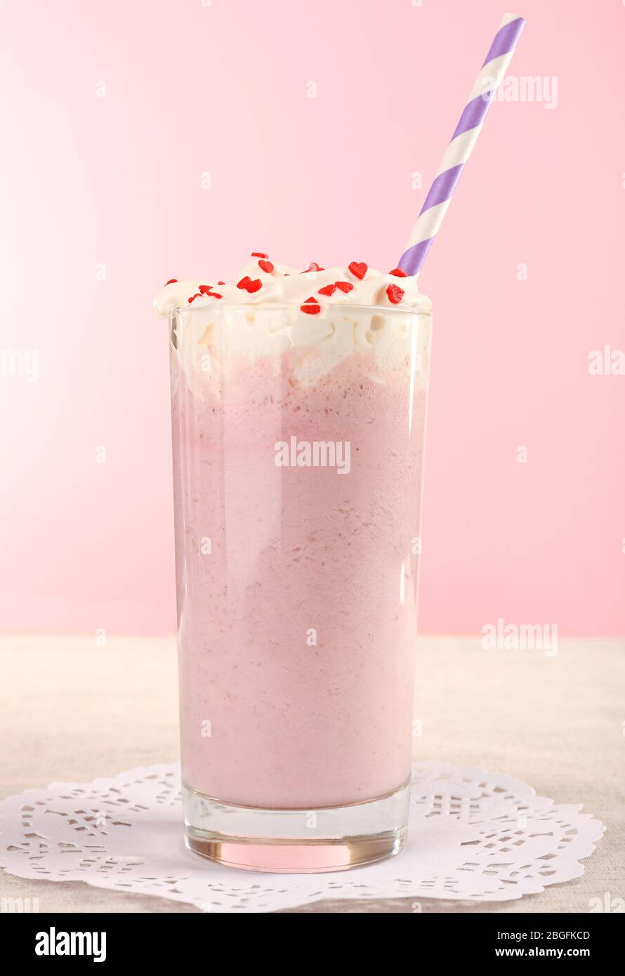 Delicious milkshake on table Stock Photo - Alamy