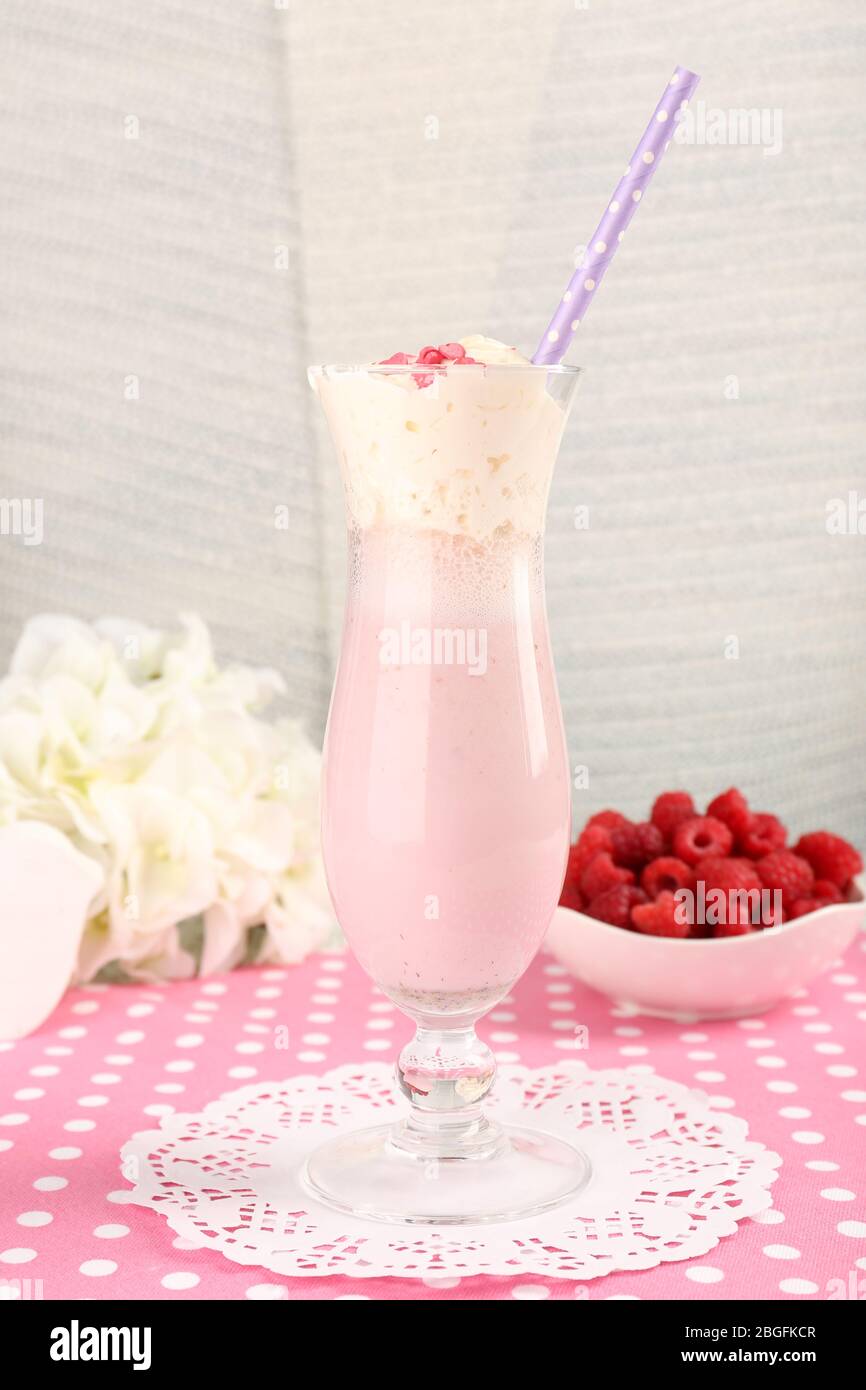 Delicious milkshake on table Stock Photo - Alamy