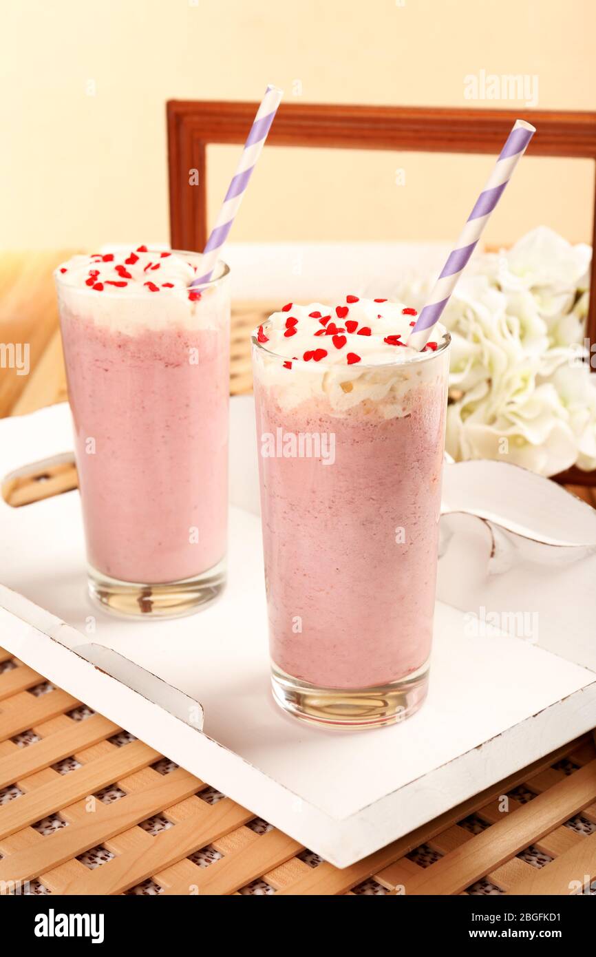 Delicious milkshake on table Stock Photo - Alamy