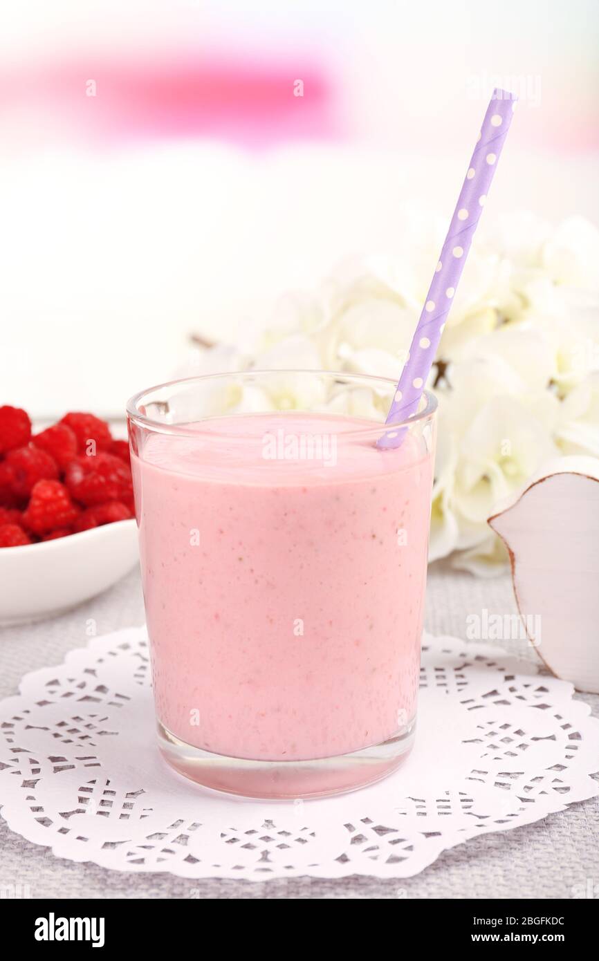 Delicious milkshake on table Stock Photo - Alamy