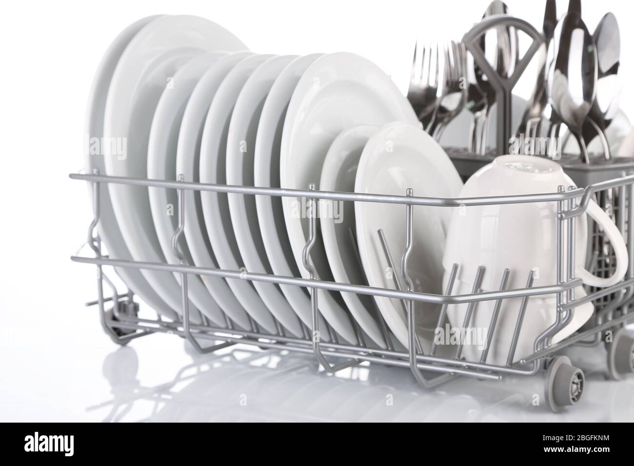 Clean dishes drying on metal dish rack, isolated on white Stock Photo ...