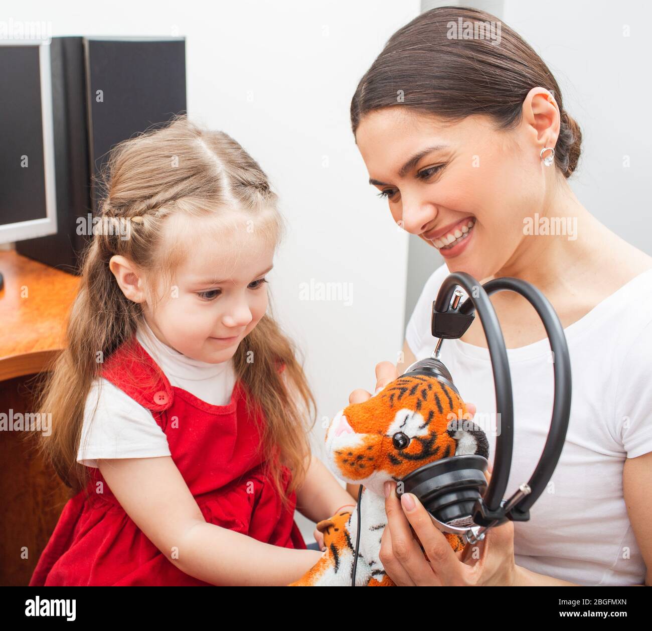 Hearing testing for a little girl patient using modern diagnostic ...
