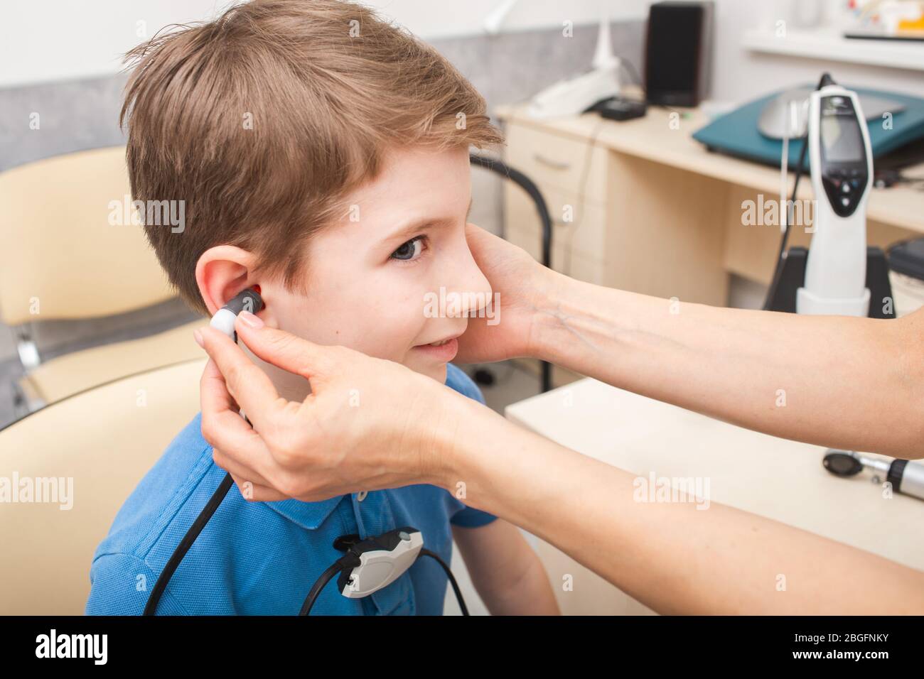 Boy in hearing clinic. Impedance audiometry. Methods for testing the ...