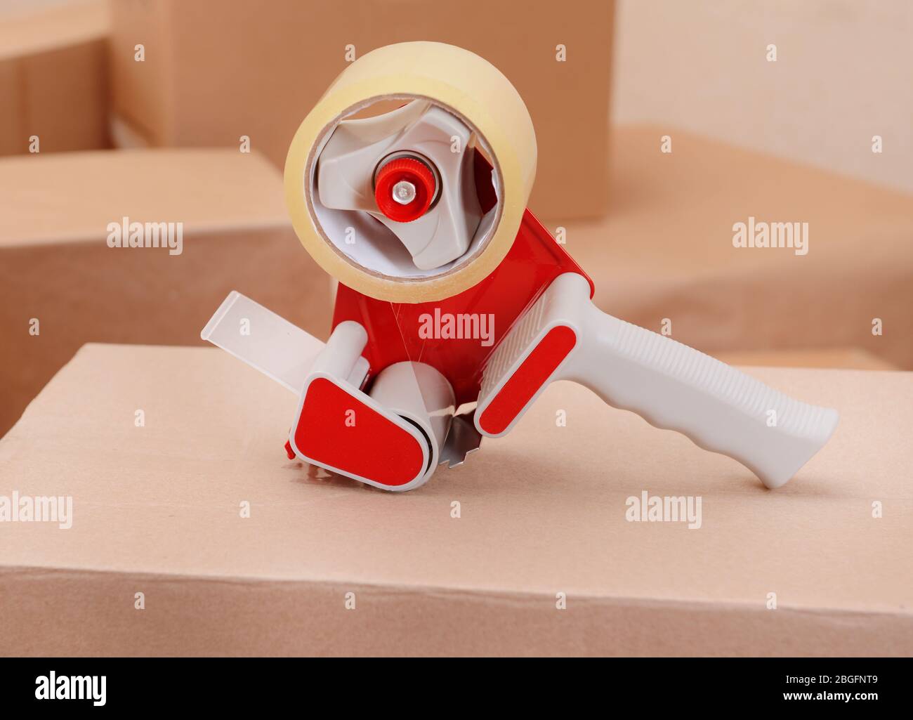 Packaging parcels with dispenser close-up Stock Photo - Alamy