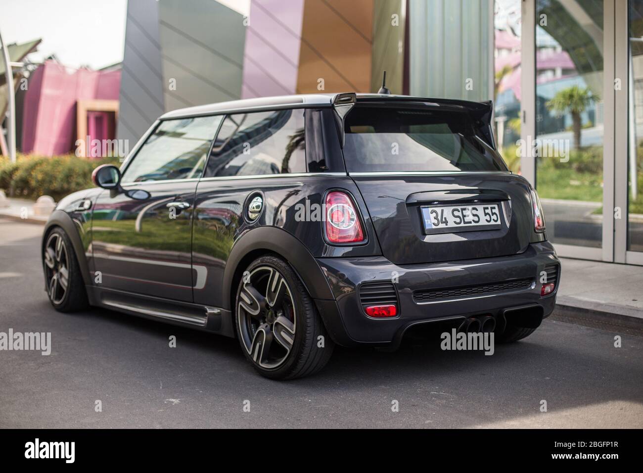 Black mini parked in front of a residence Stock Photo - Alamy