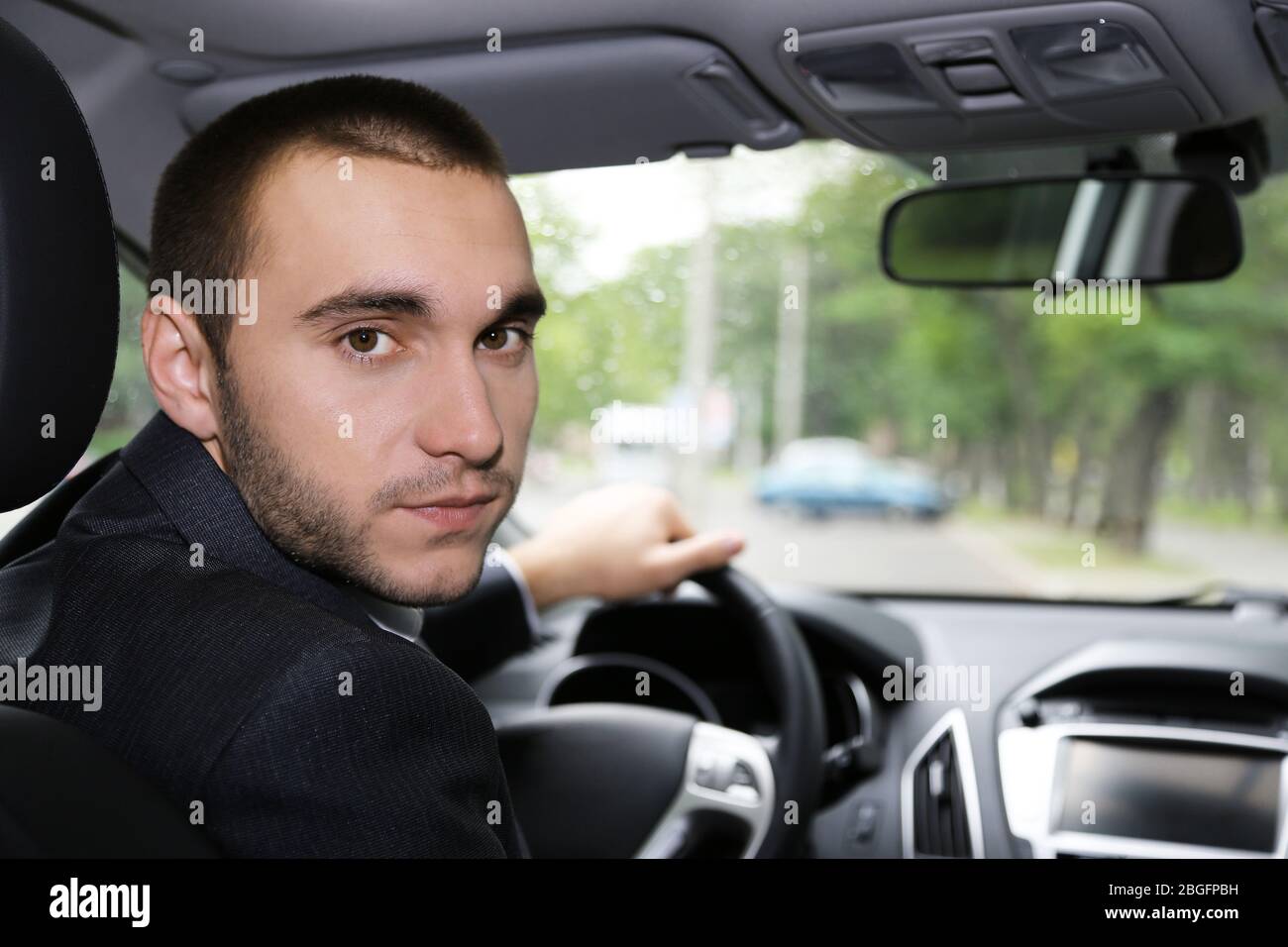 Man driving car Stock Photo - Alamy