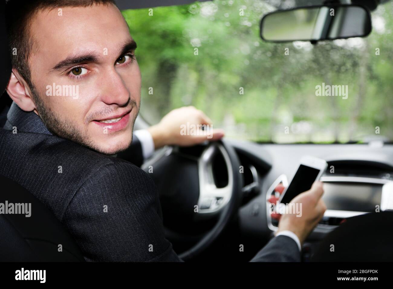 Man driving car Stock Photo - Alamy