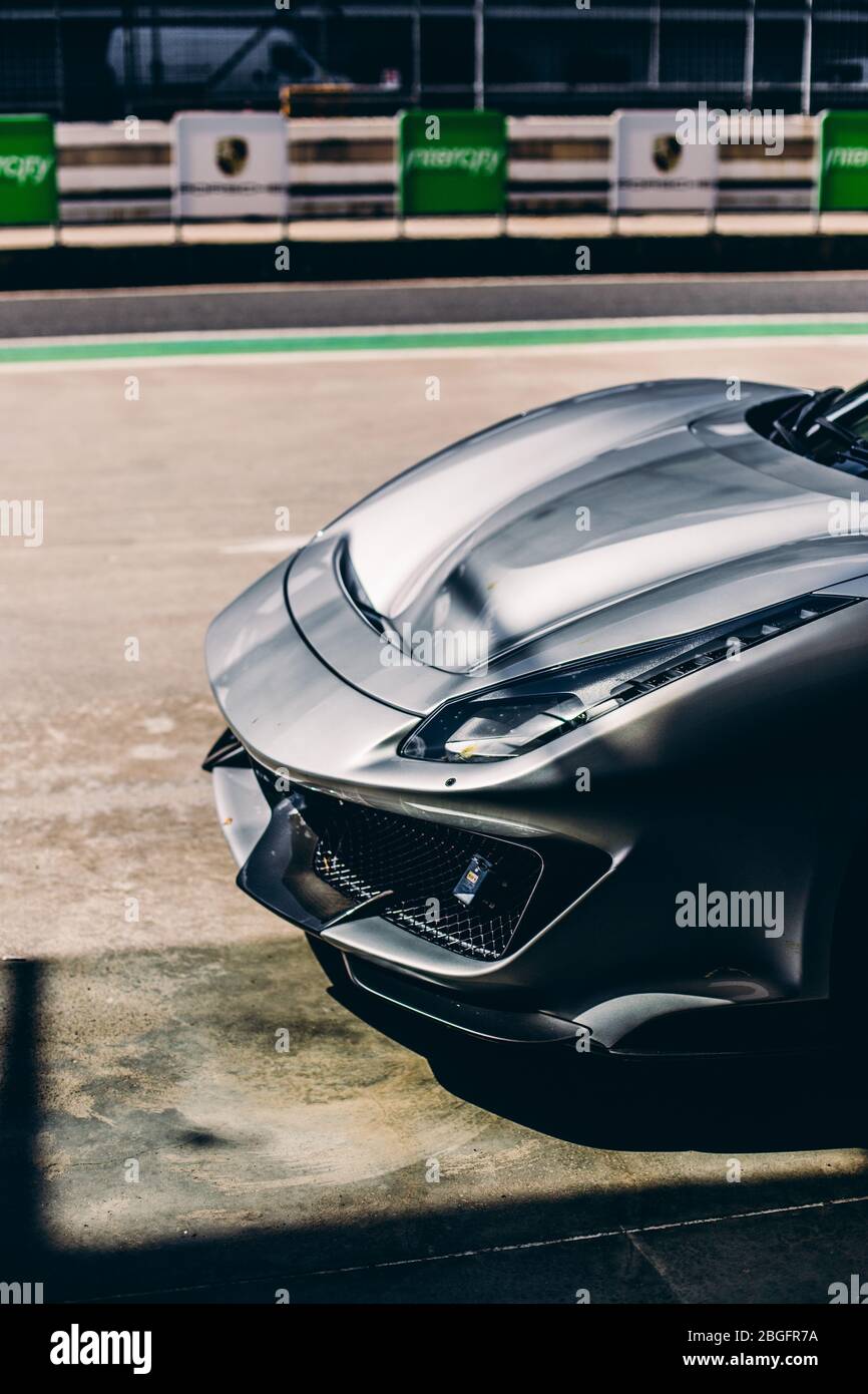 Front bumper and lights of a silver car in the stadium Stock Photo - Alamy