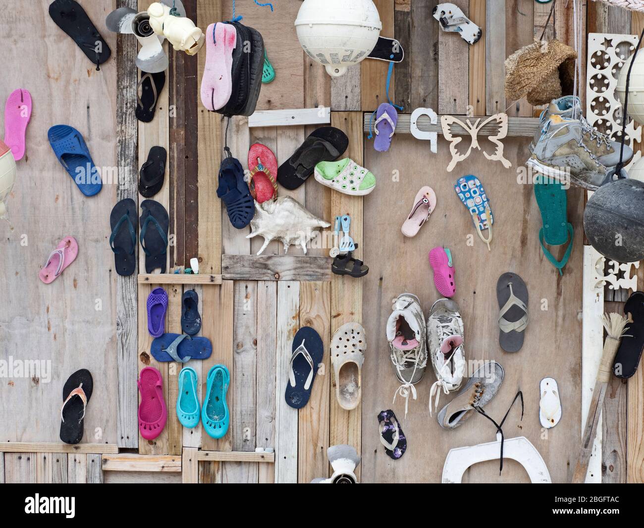 Plastic rubbish decorating wall picked up washed ashore on Wizard ...