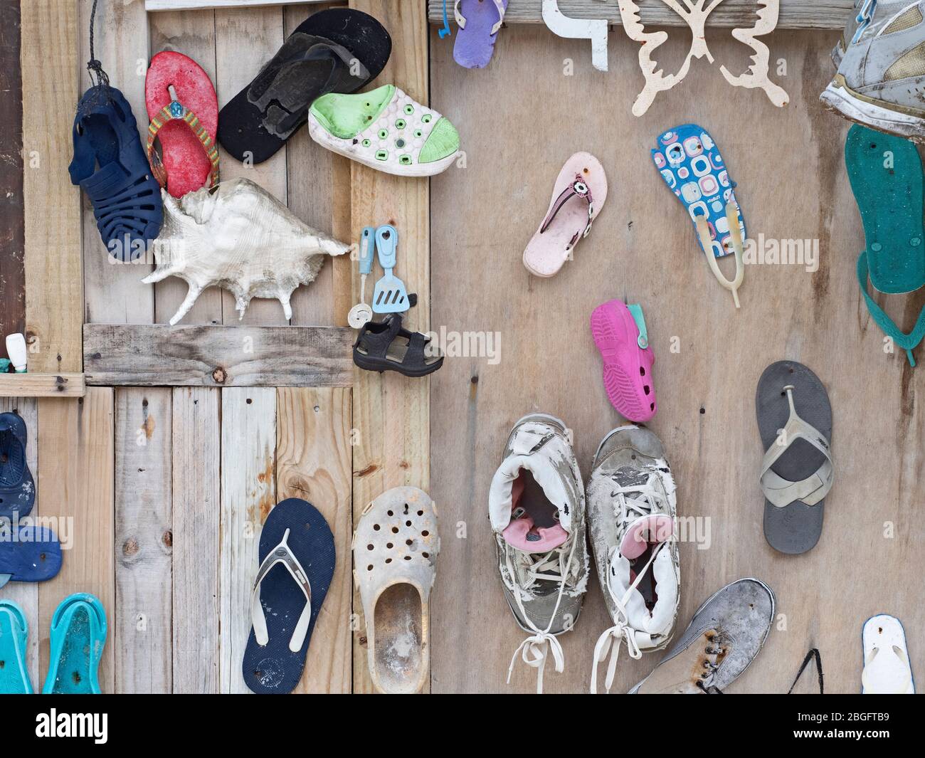 Plastic rubbish decorating wall picked up washed ashore on Wizard ...