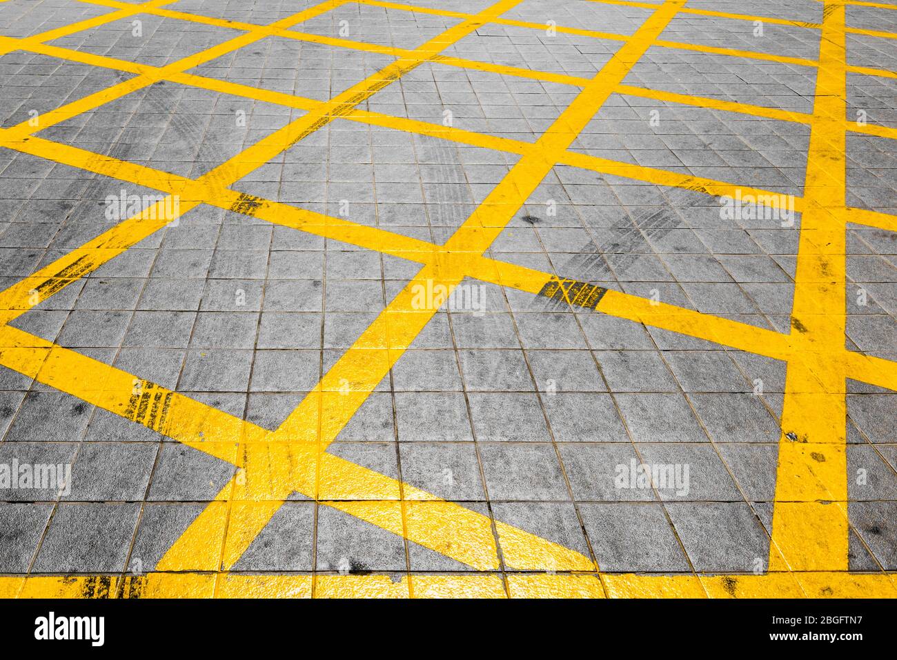 Abstract background with yellow lines on ground Stock Photo - Alamy