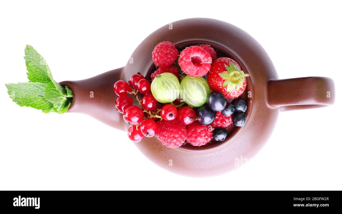 Forest berries and mint leaves in teapot, isolated on white Stock Photo ...