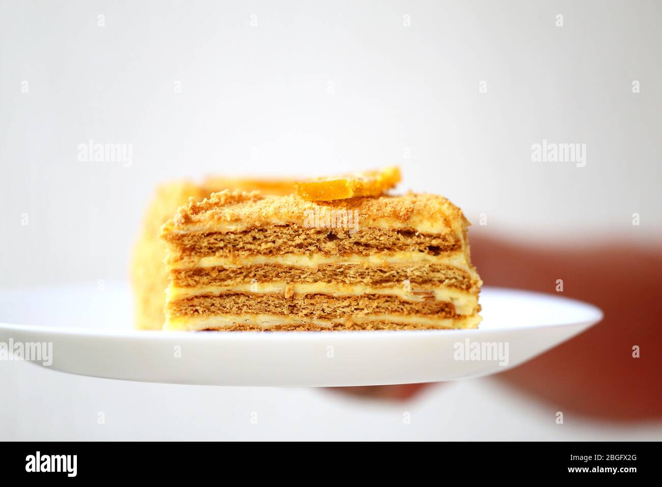 Photo of a delicious big honey cake in a cafe Stock Photo - Alamy