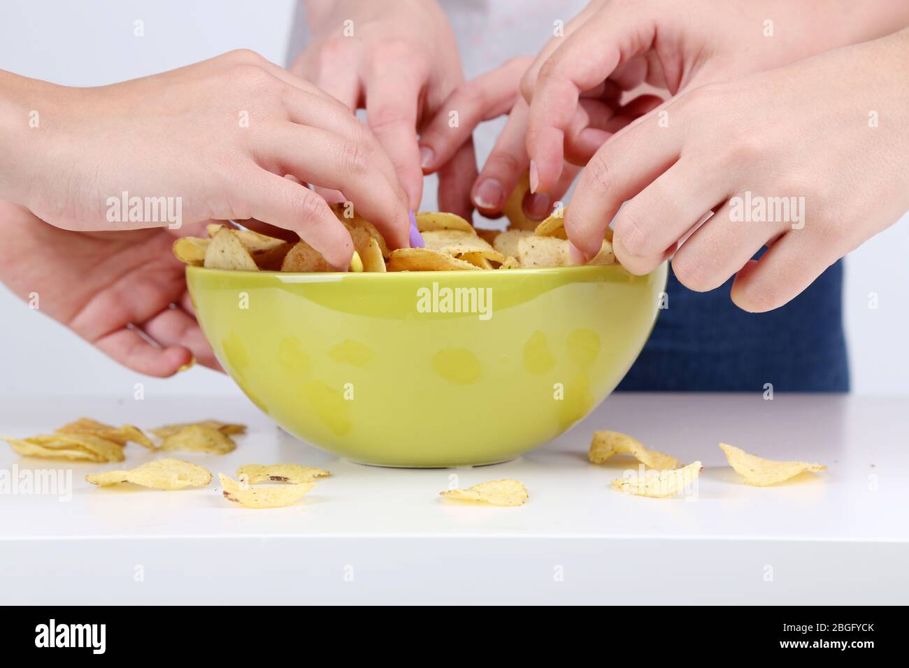 Take chips from bowl hi-res stock photography and images - Alamy