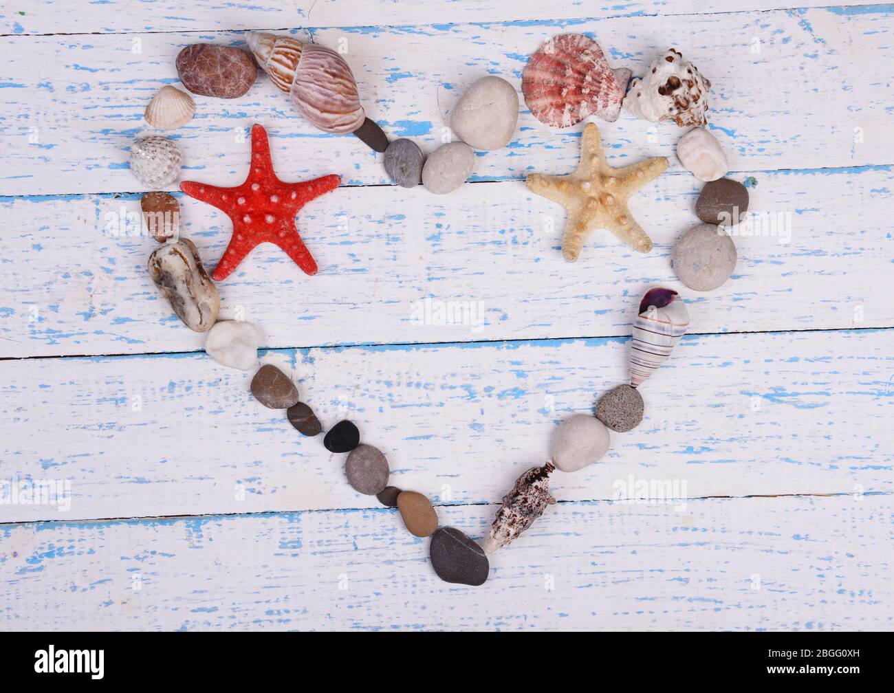 Heart made shells on beach hi-res stock photography and images - Alamy