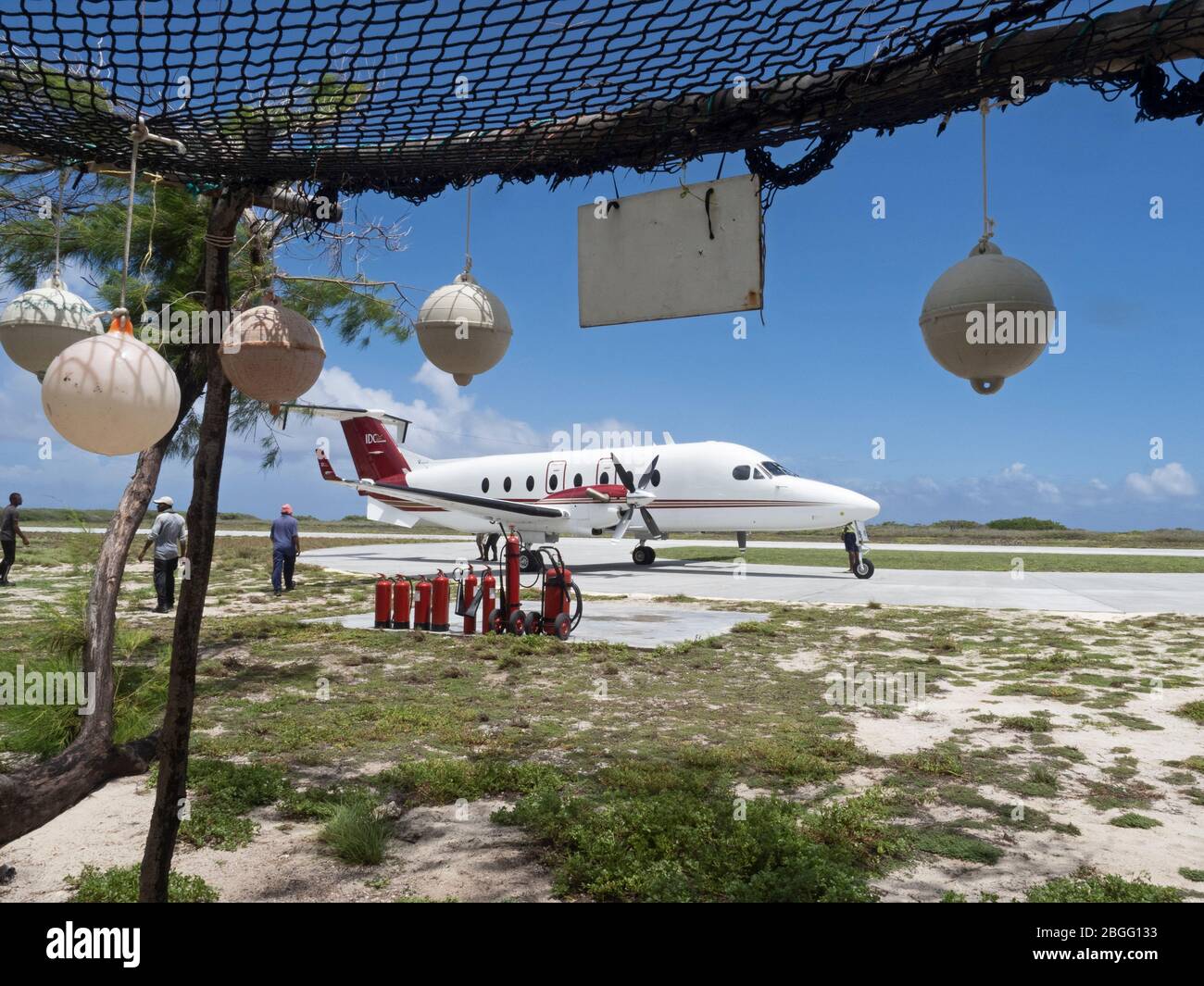 Beechcraft 1900 aircraft arriving to pick up passengers on Astove Atoll ...