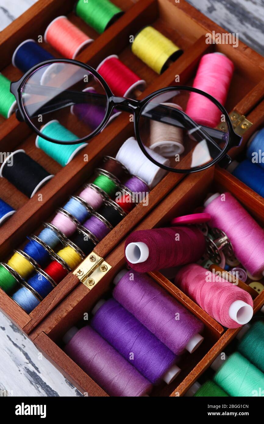 Colorful threads for needlework in wooden box close up Stock Photo - Alamy