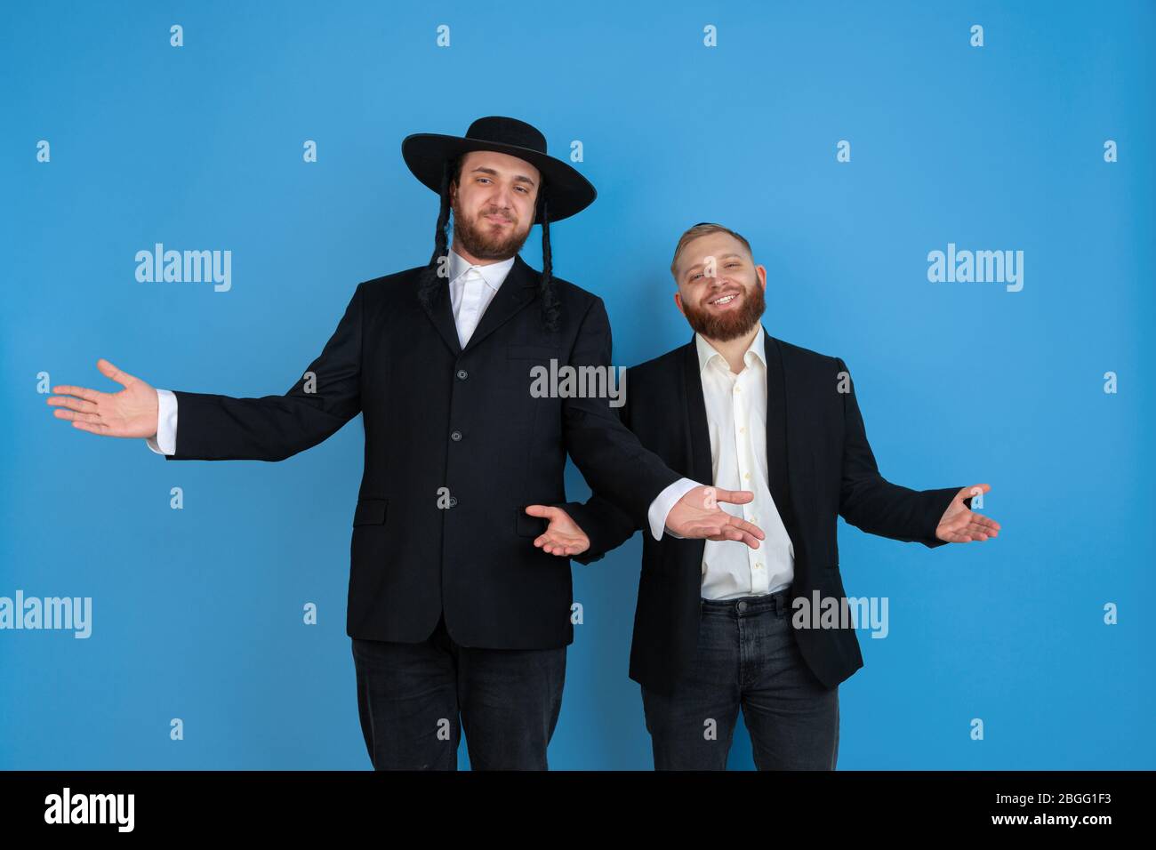 Greeting, inviting. Portrait of a young orthodox jewish men isolated on ...