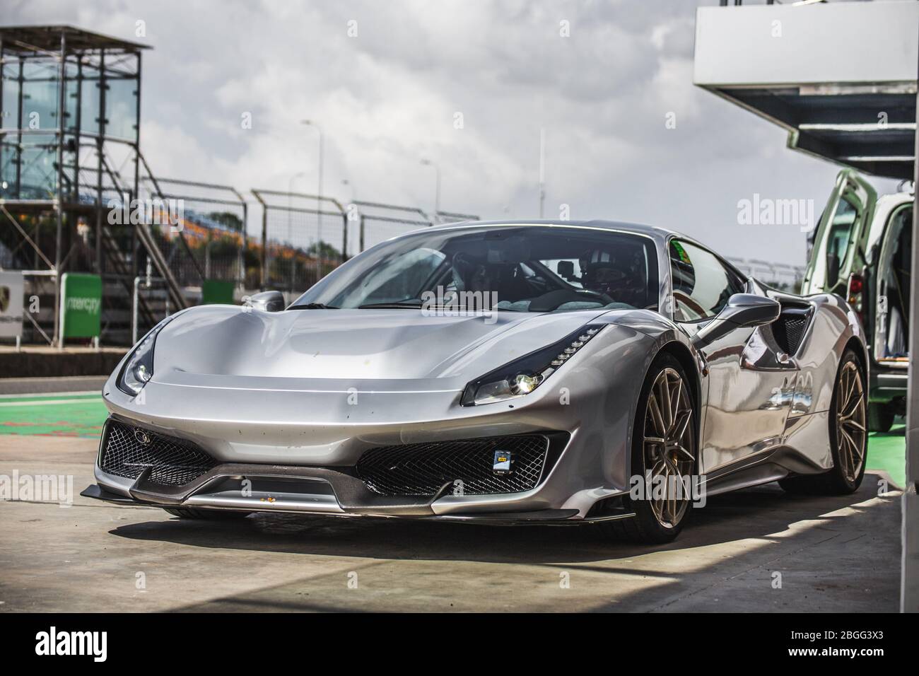 Silver racing car getting ready for a autoshow in the performance ...
