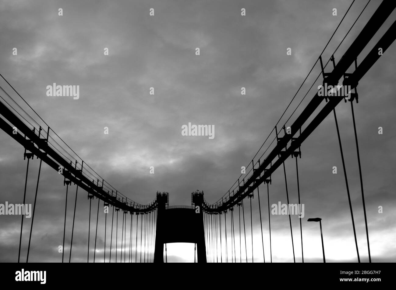 Large suspension bridge spanning a wide river Stock Photo - Alamy