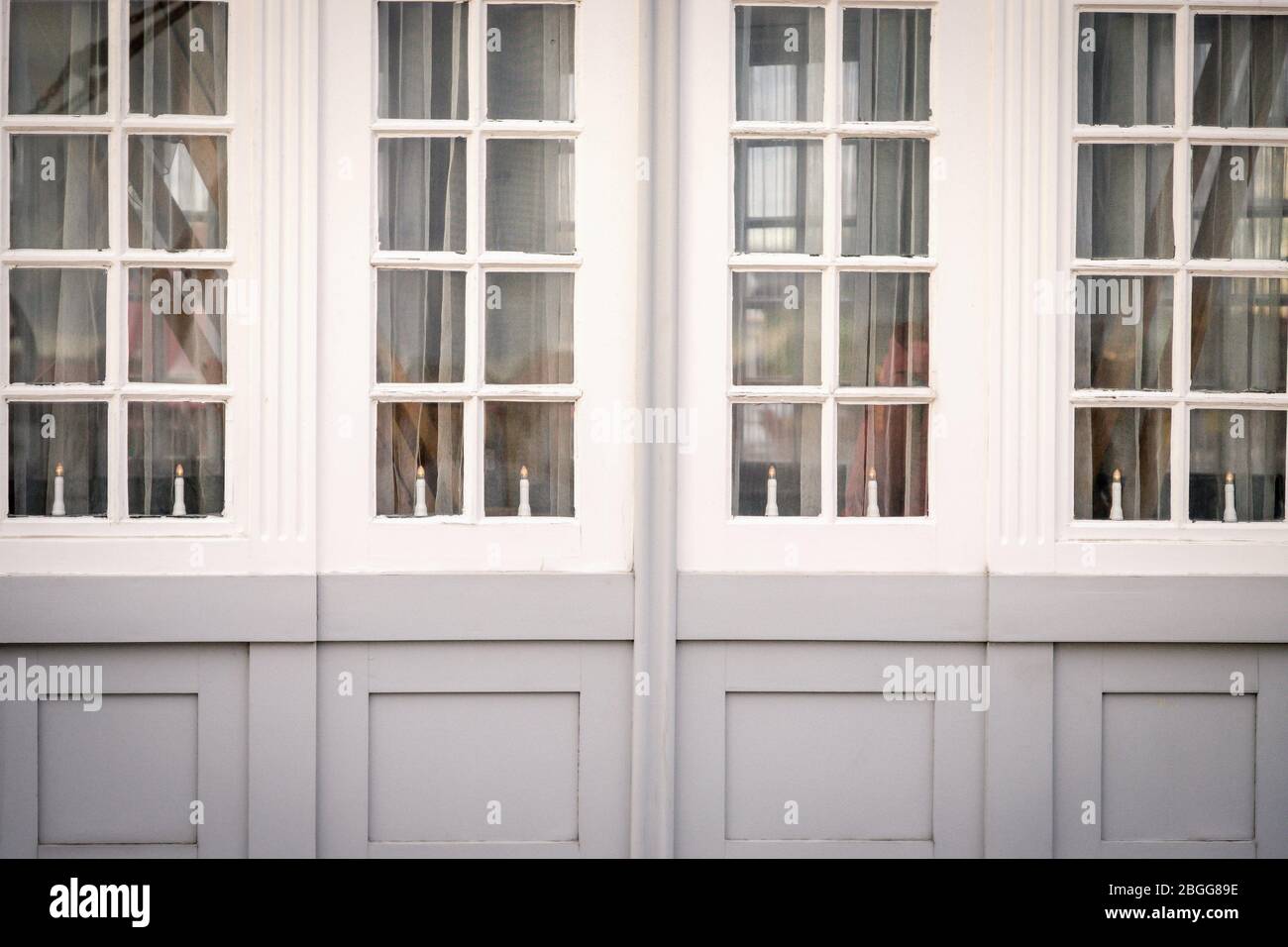 Large vintage windows with candles. White and gray colors. Copenhagen ...