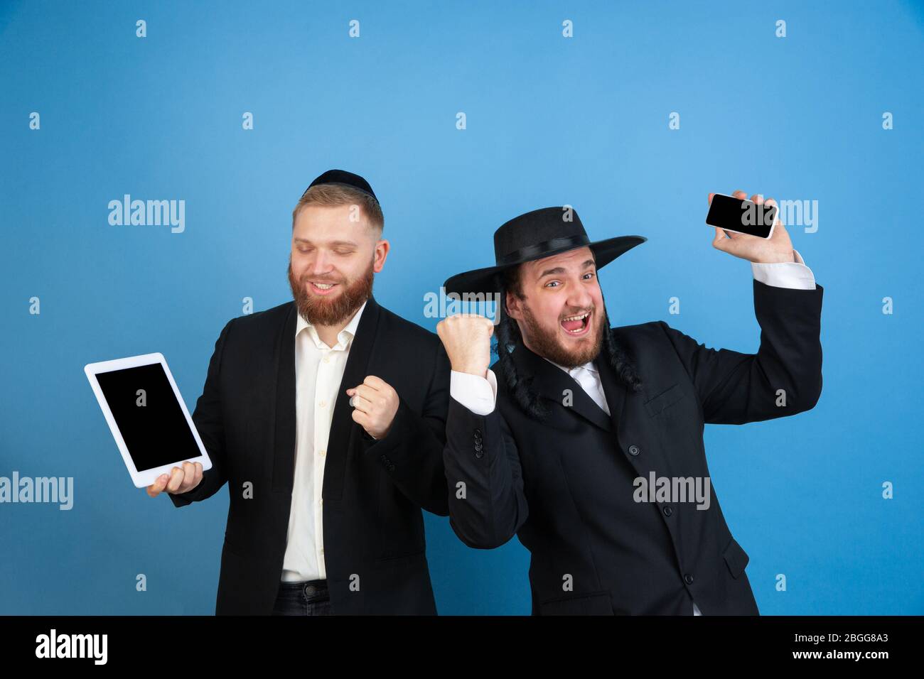 Showing blank devices screen. Portrait of a young orthodox jewish men ...