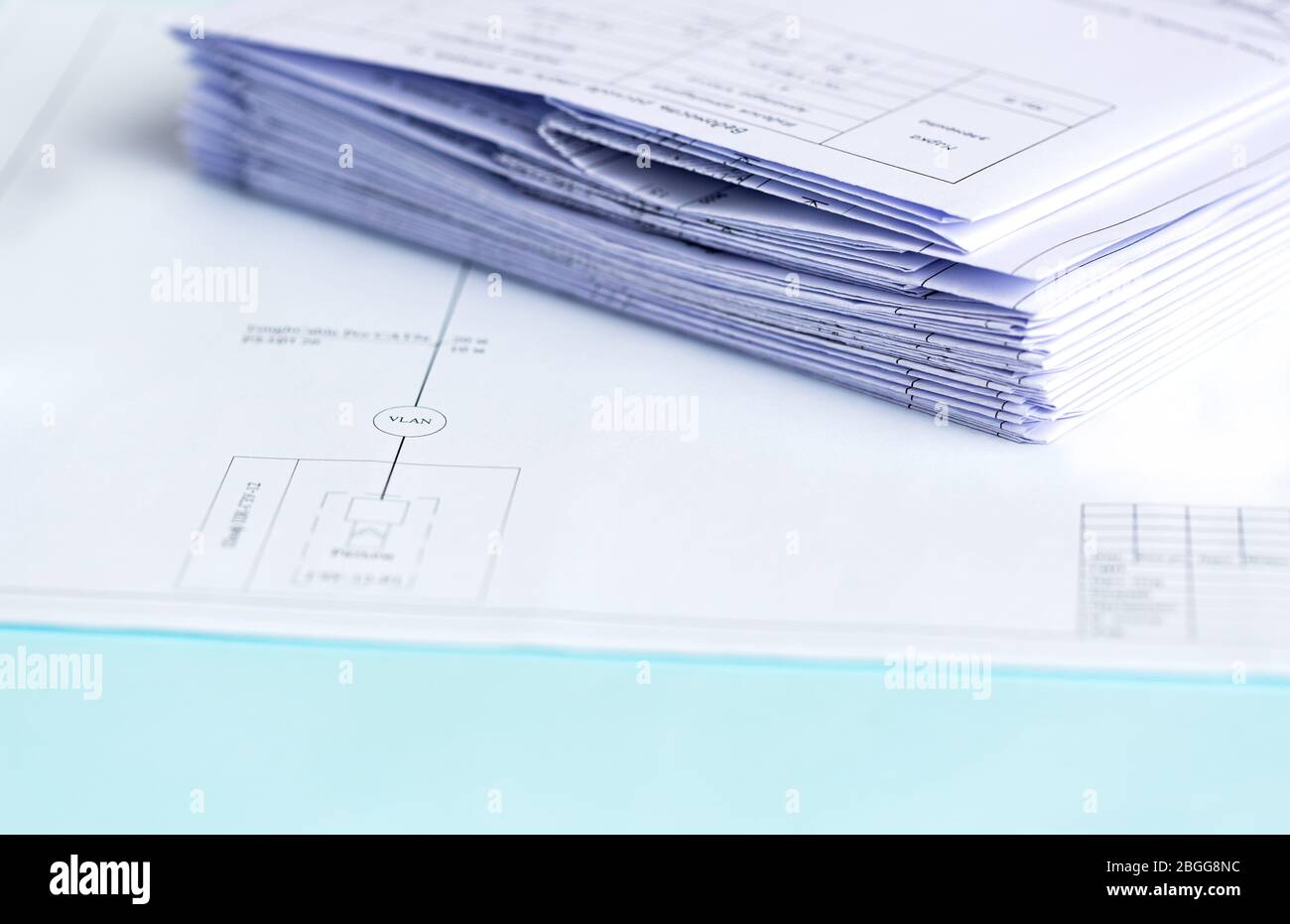 Stack Folding drawings on a blue background. Top view. Flat lay. Copy ...