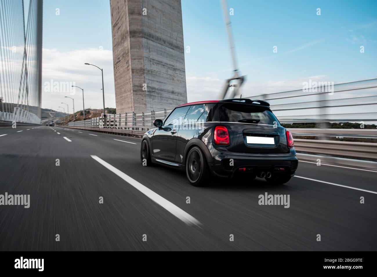 Black color supercar autoshow on the bridge,view from behind Stock ...