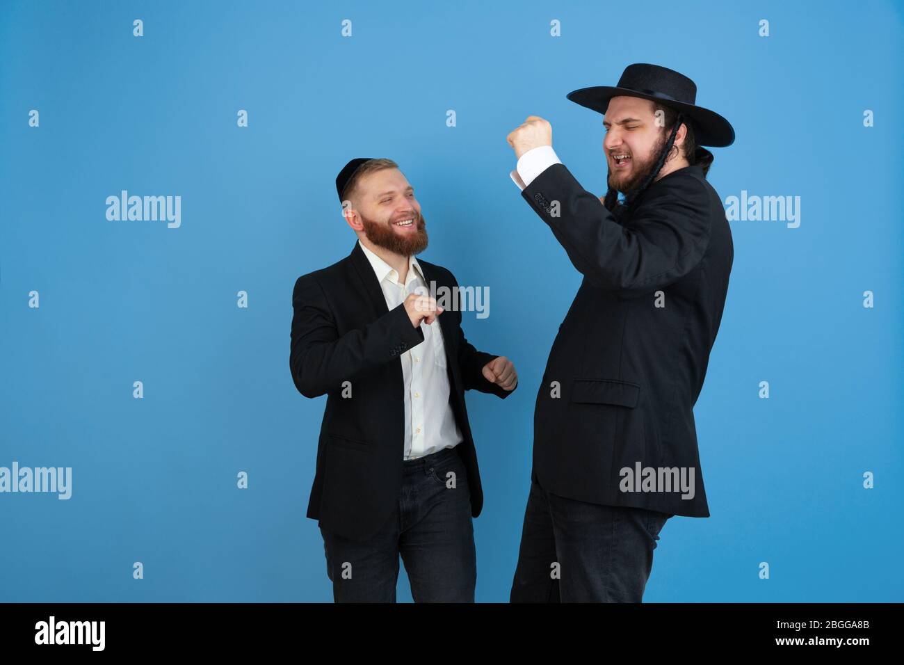 Dancing, having fun. Portrait of a young orthodox jewish men isolated ...