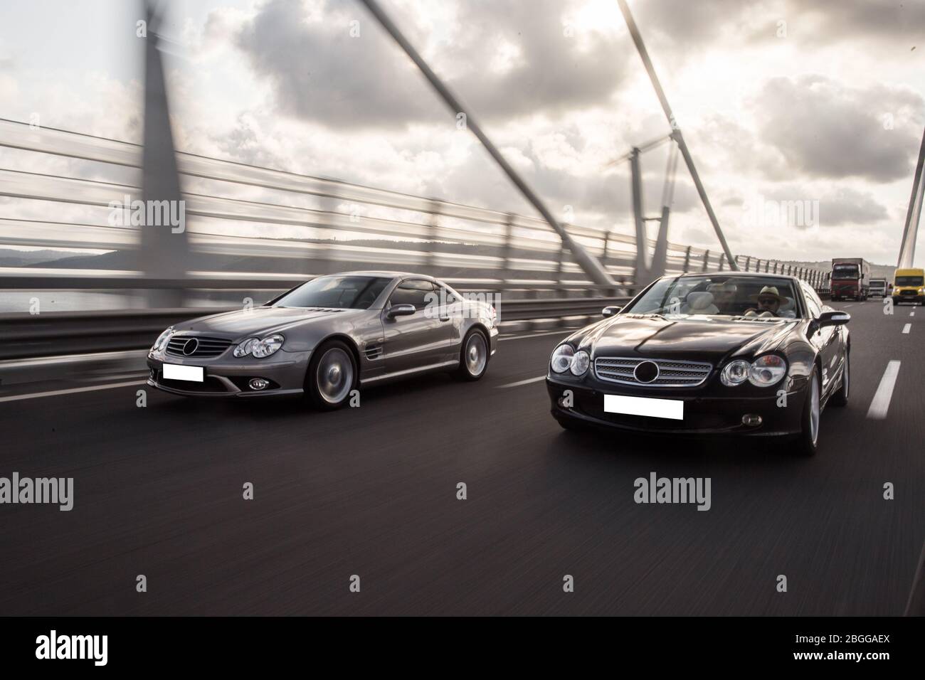 Cars chasing on the modern bridge Stock Photo - Alamy