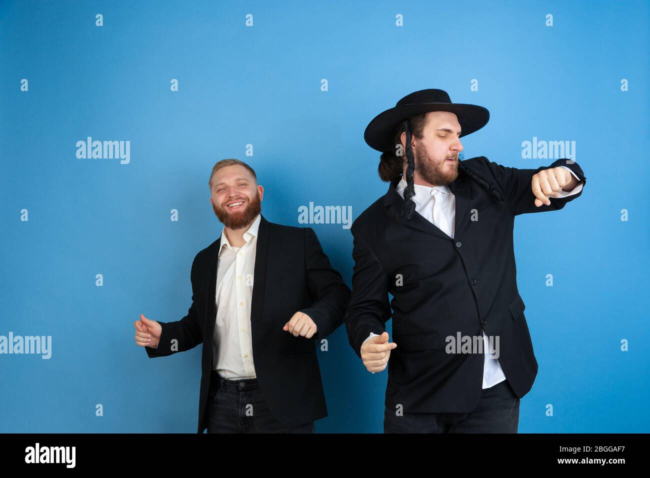 Dancing, having fun. Portrait of a young orthodox jewish men isolated ...