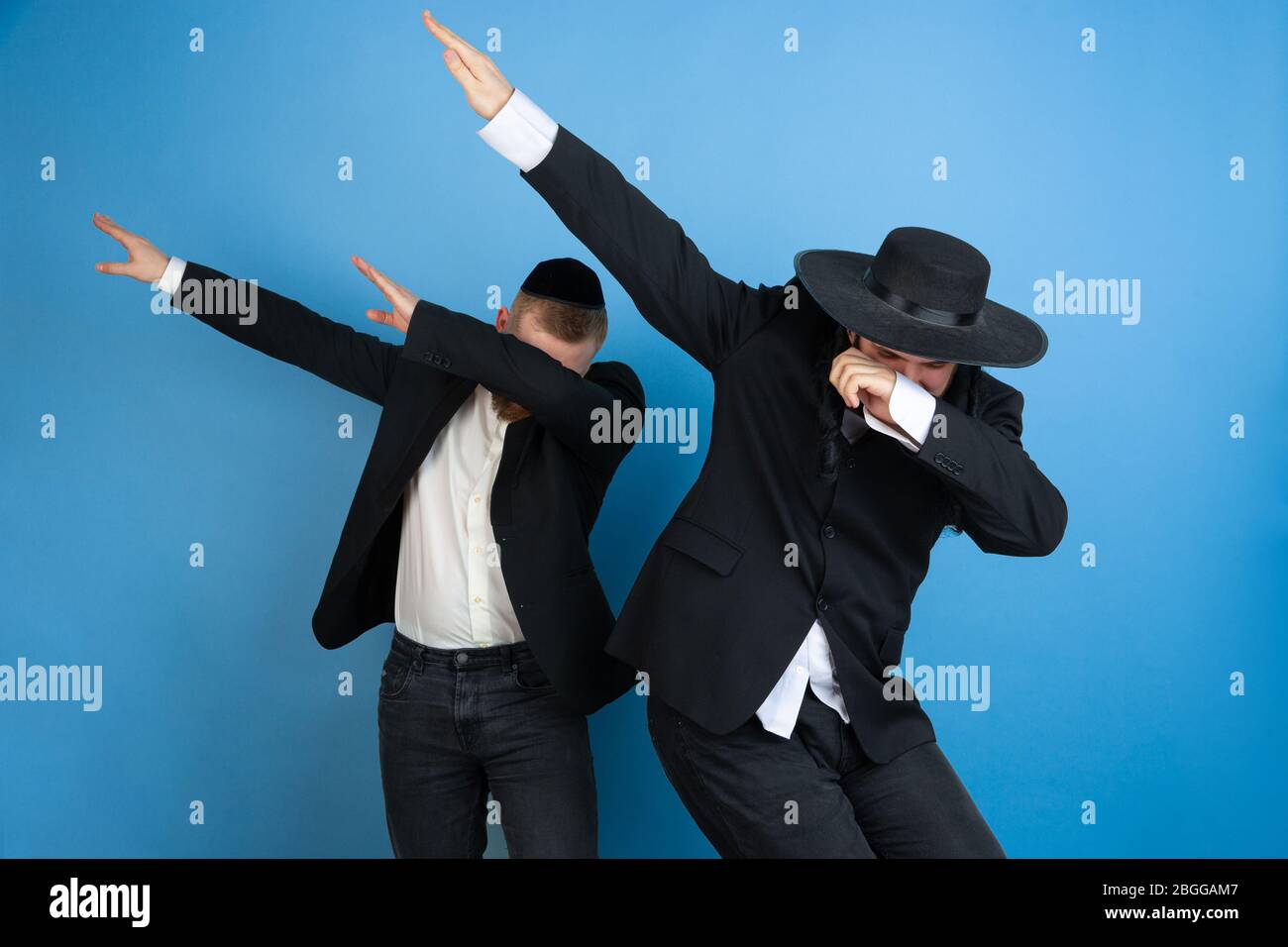 Dabbing, having fun. Portrait of a young orthodox jewish men isolated ...