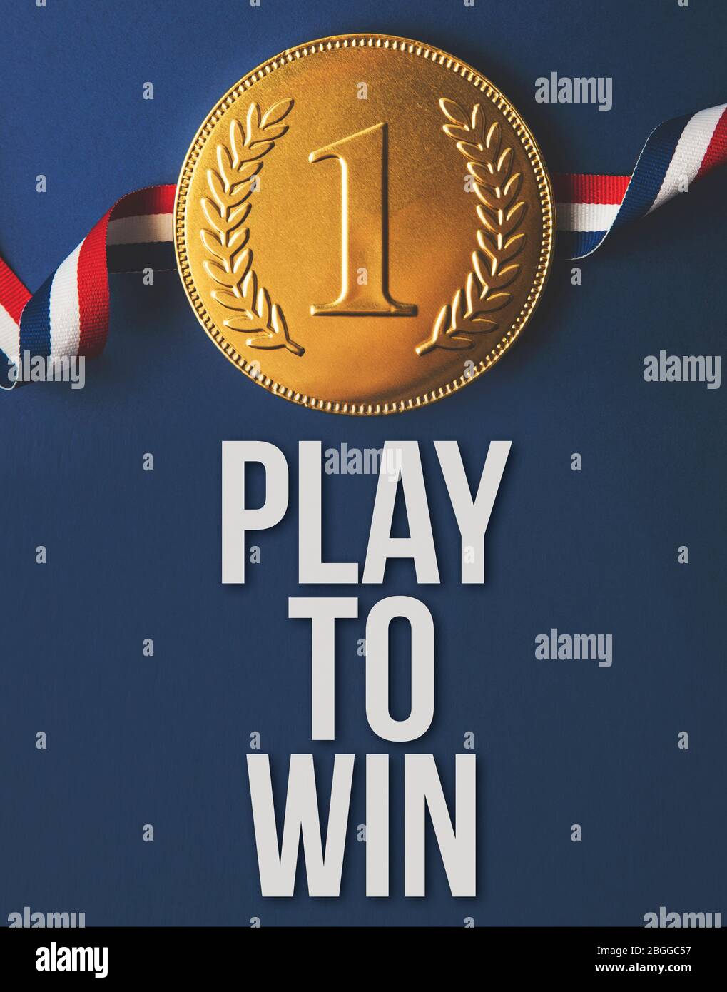 Play to win motivational message with gold winning medal Stock Photo ...