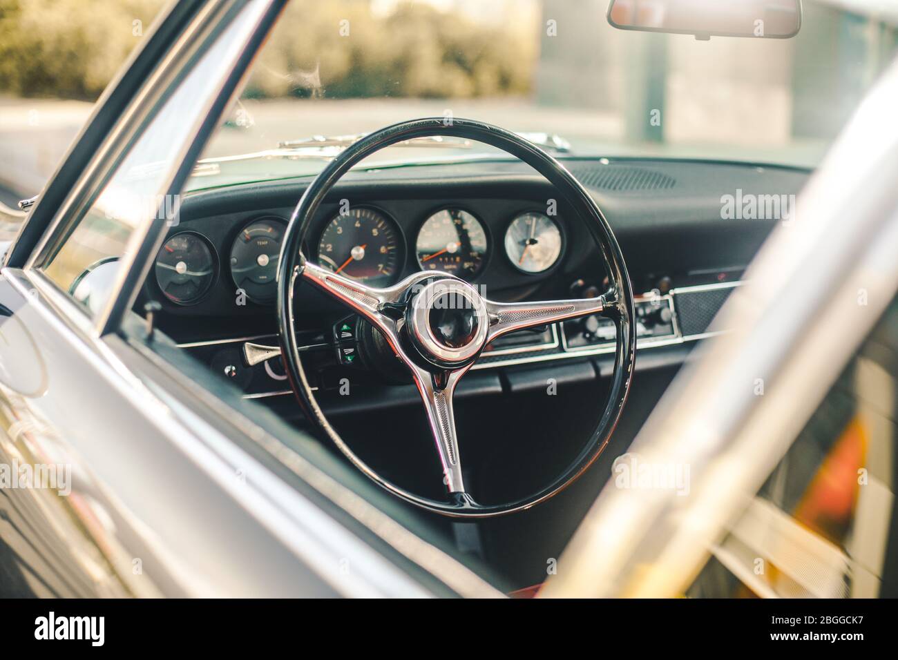 Control panel of a retro car, view through window Stock Photo - Alamy