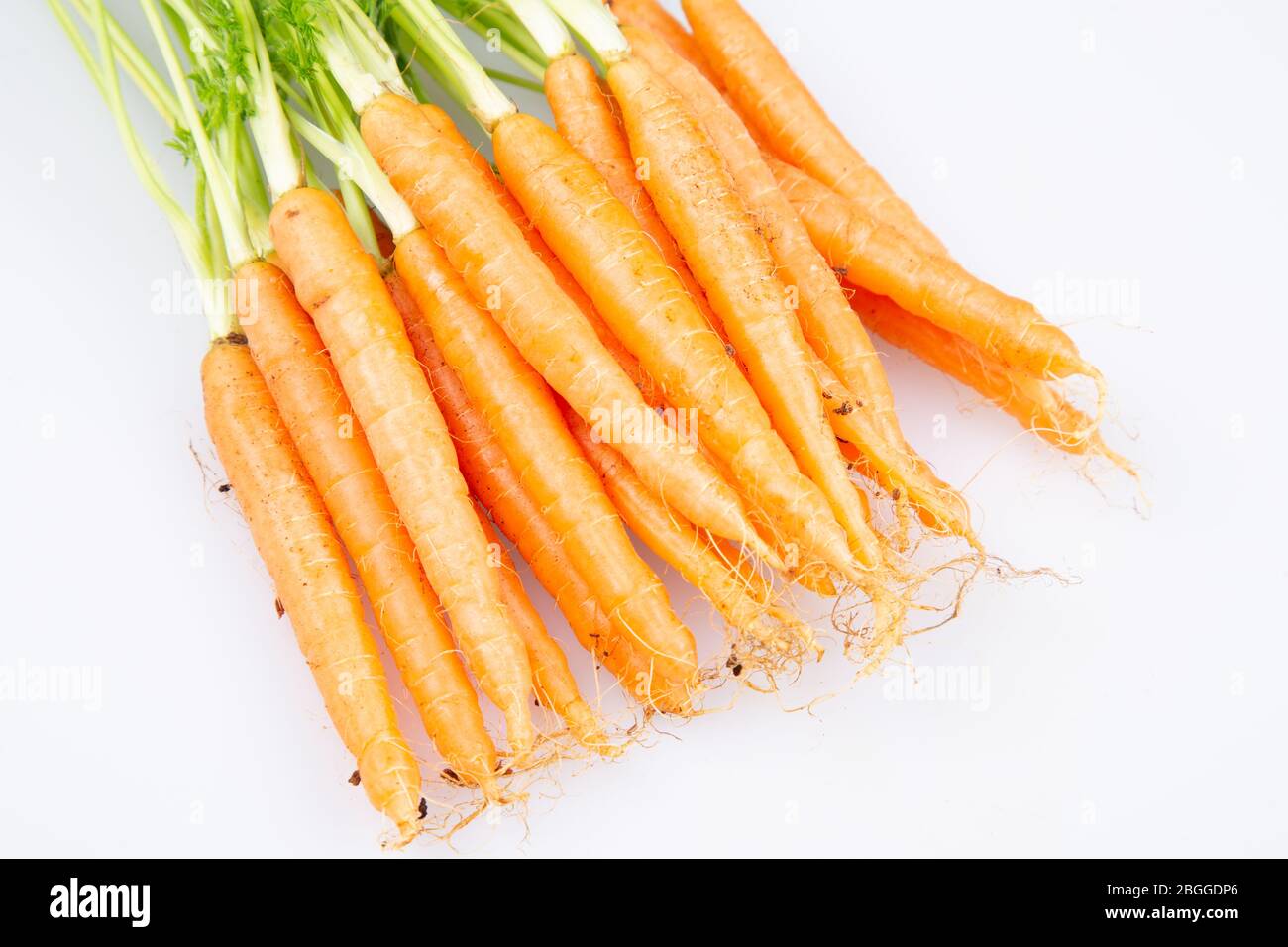 vegetable carrots raw lots fresh in white background Stock Photo - Alamy