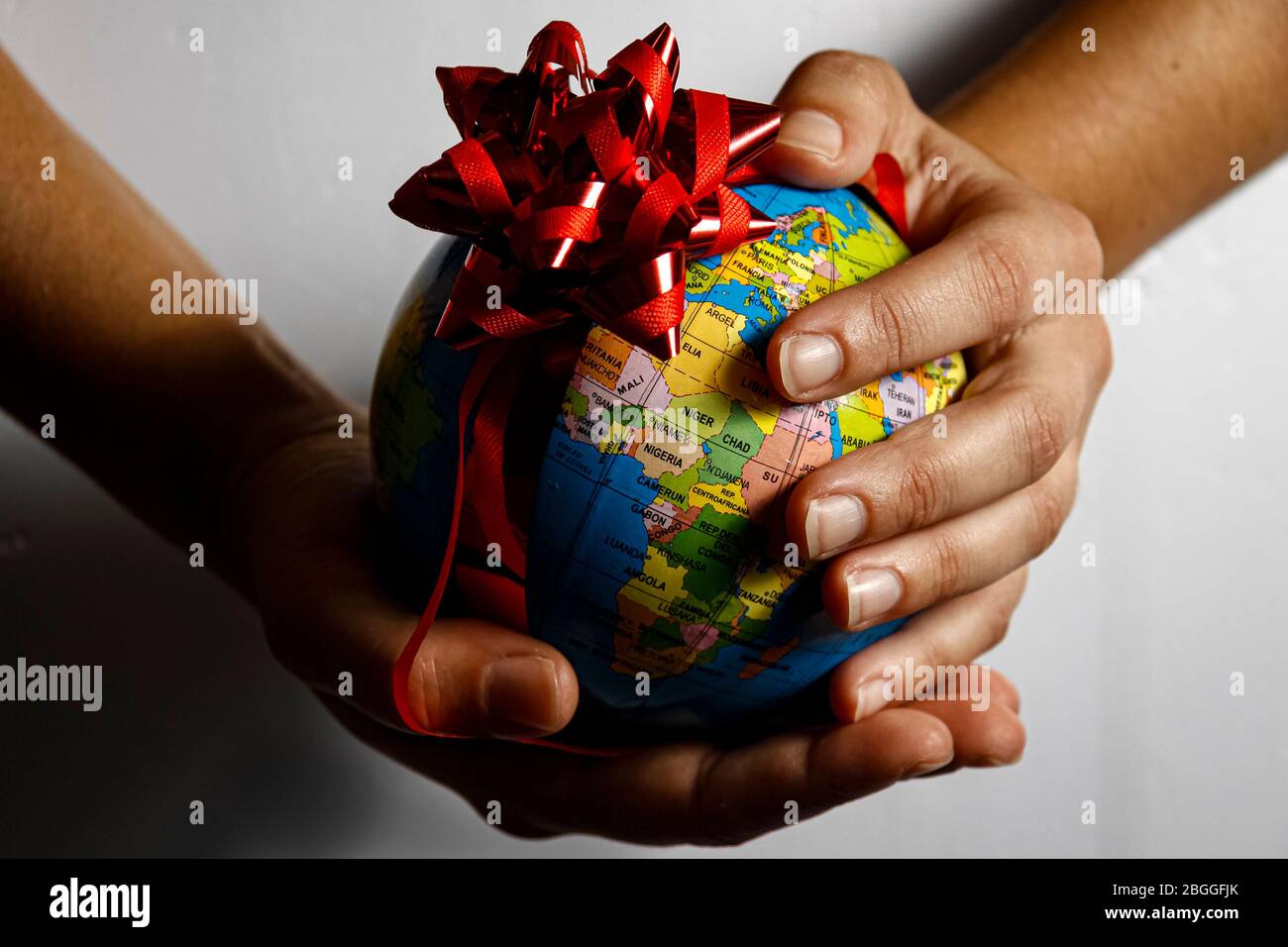 hands and world globe © ABEL F. ROS/Alamy Stock Photo - Alamy