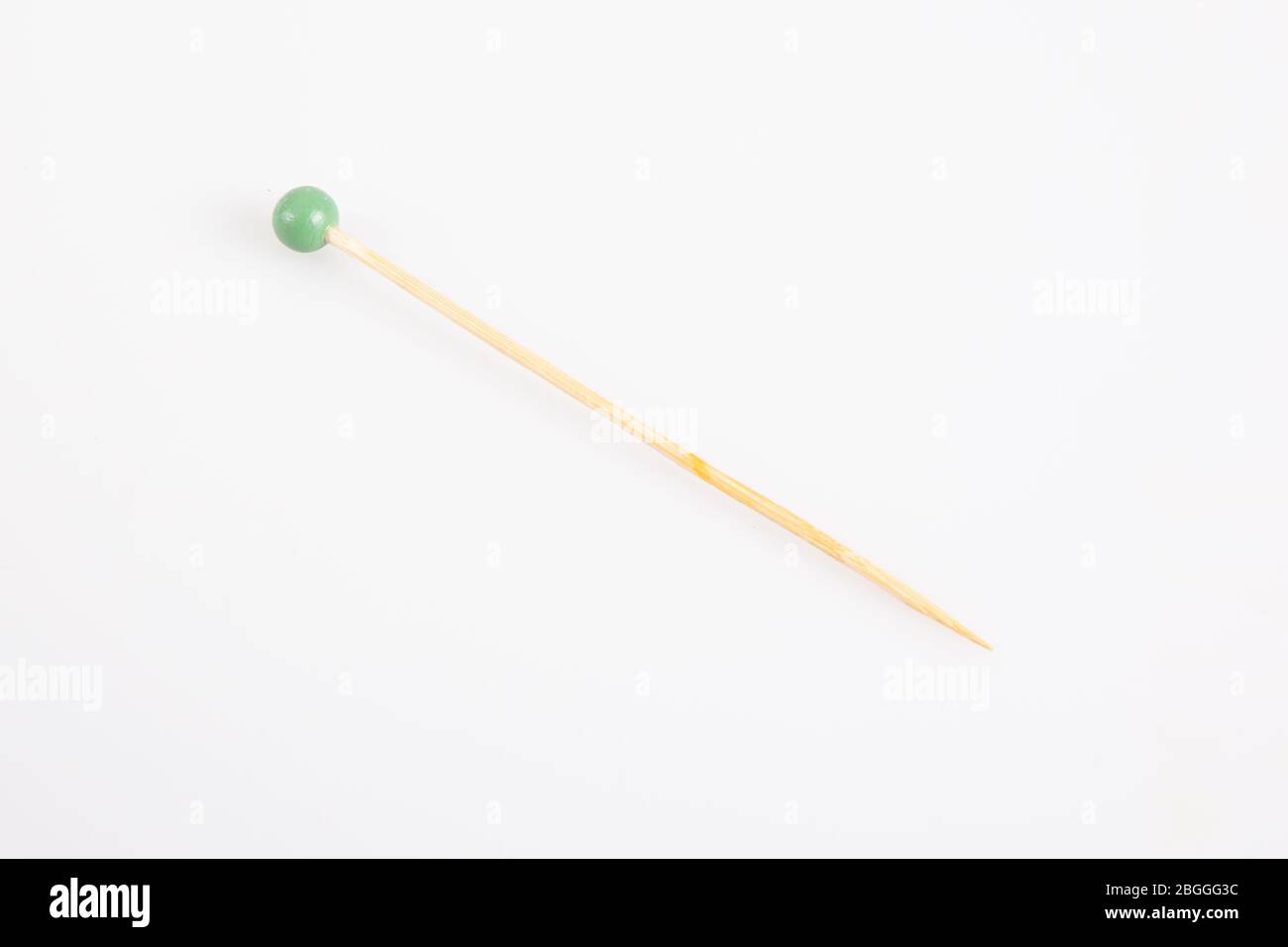 Toothpicks food pick with green handle ball Stock Photo - Alamy