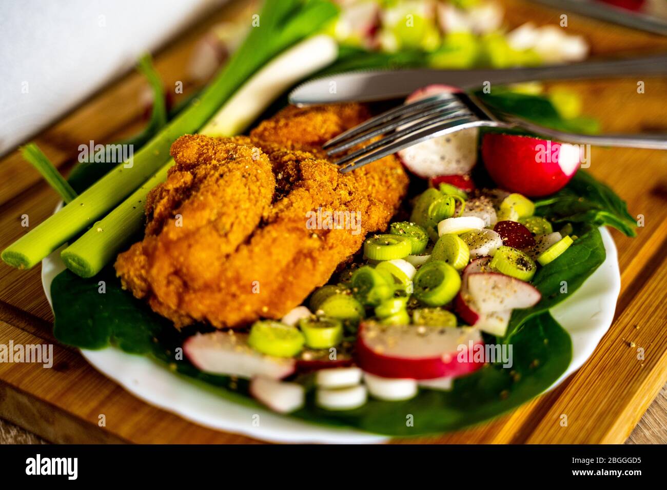 Cutting fried fish knife fork hi-res stock photography and images - Alamy