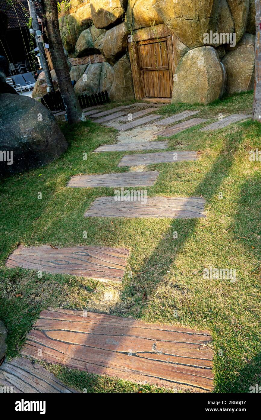 Walking path made with wood slab in a resort Stock Photo - Alamy