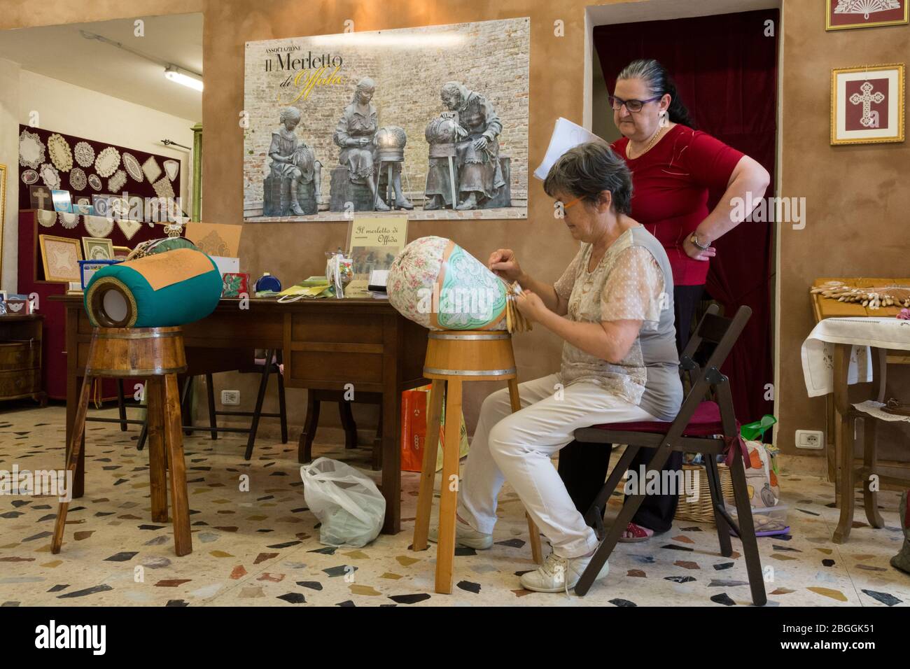 women working the pillowlace in the medieval Village of Offida, Marche ...